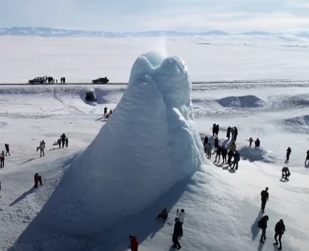 Ice volcano spewing mist grows from an underground hot spring in ...