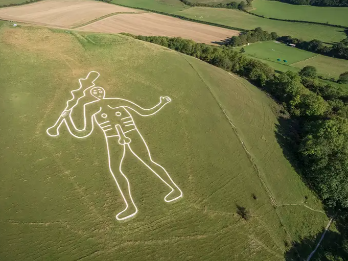 Naked giant carved into English hillside is 'only' medieval, not ...