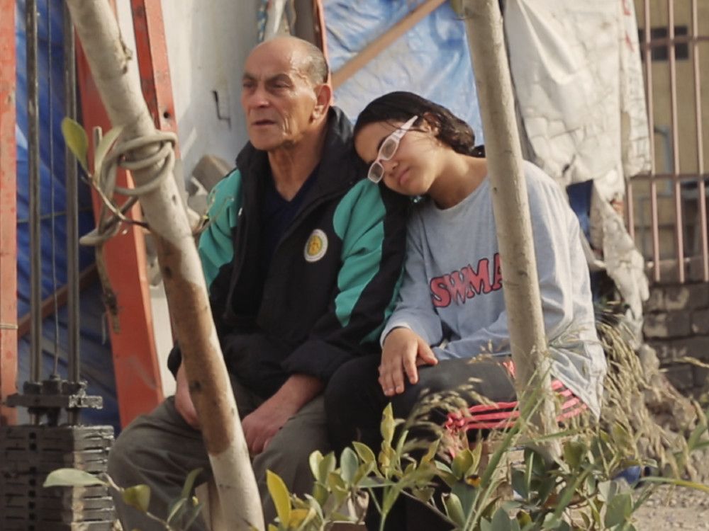 A rambunctious coach trains young female weightlifters in Lift Like a ...