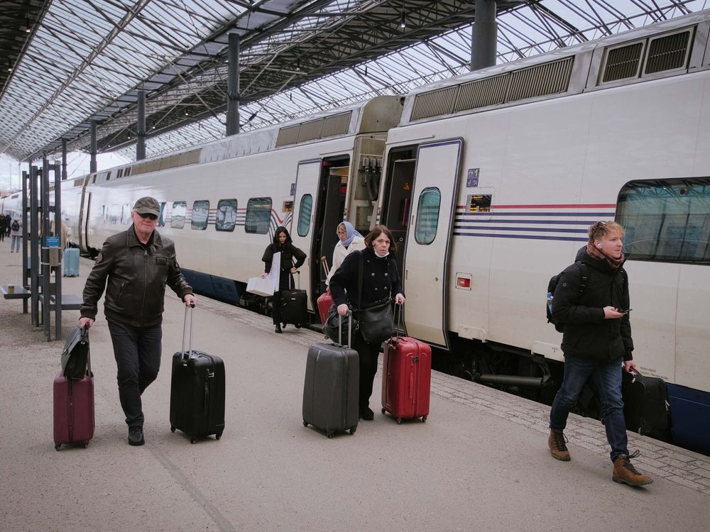 Russians trying to move abroad crowd into few remaining trains and ...