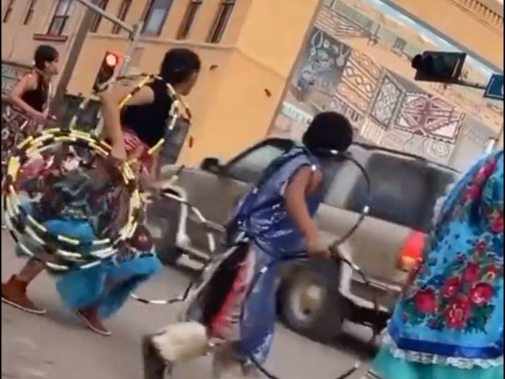 SUV carrying several people drives into Native American parade, causing ...