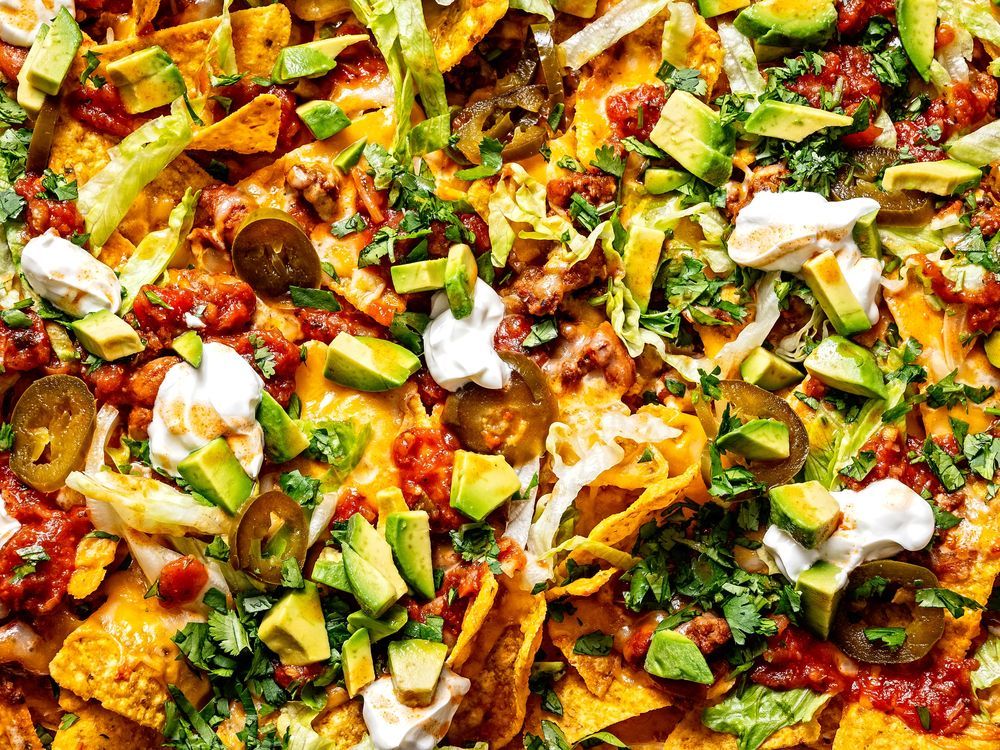 These loaded nachos are cheesy, saucy and fit for dinner, too ...