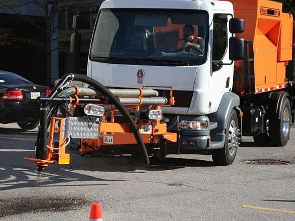 City of Greater Sudbury, pothole repair study, throw and roll method ...