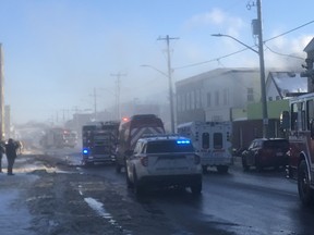 North Bay firefighters rescue woman from burning downtown building ...