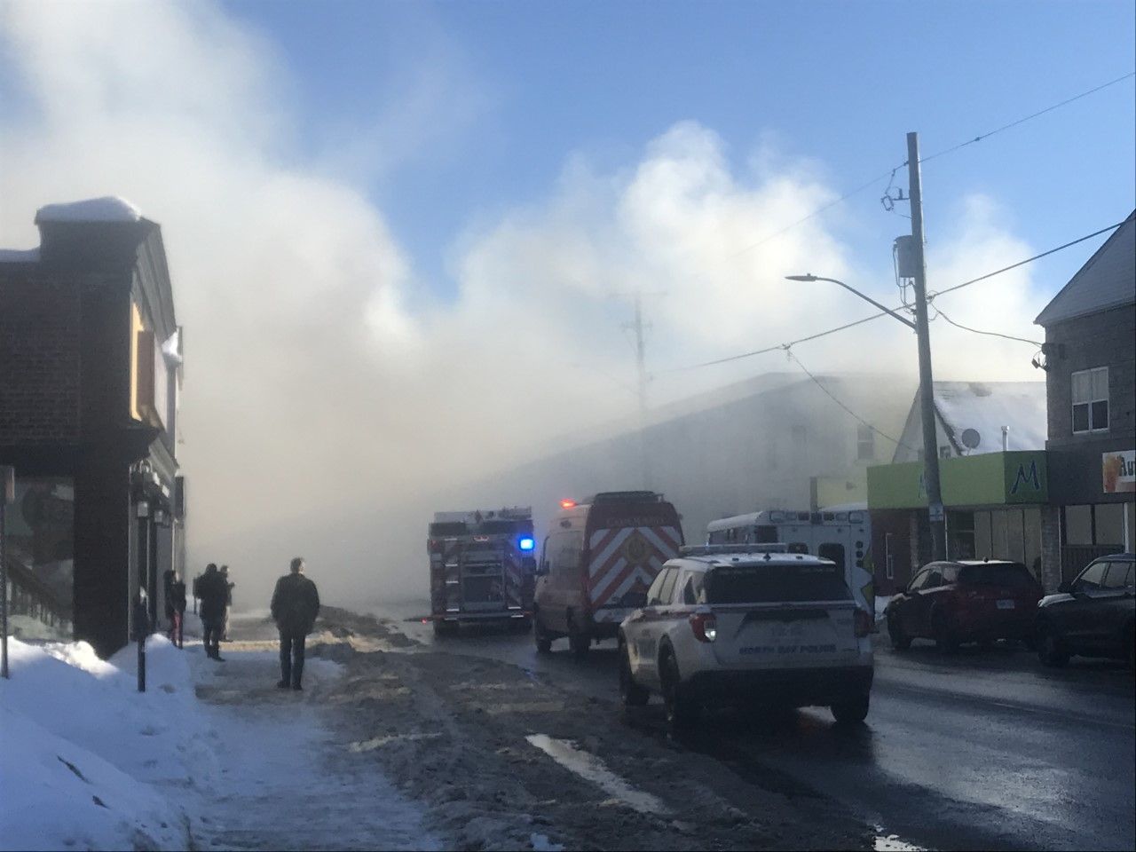North Bay firefighters rescue woman from burning downtown building ...