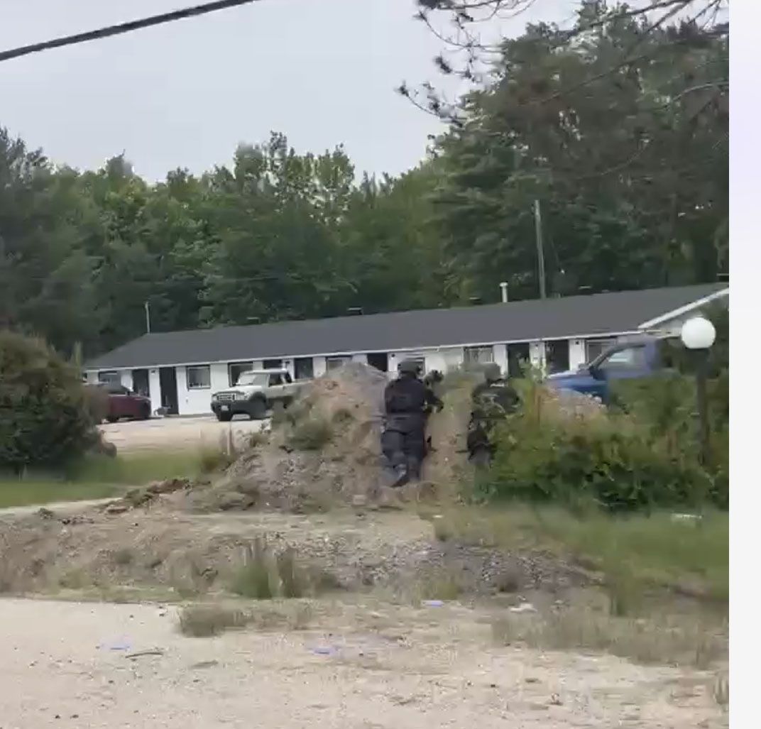 North Bay police surround Highway 11 North apartment building | North ...