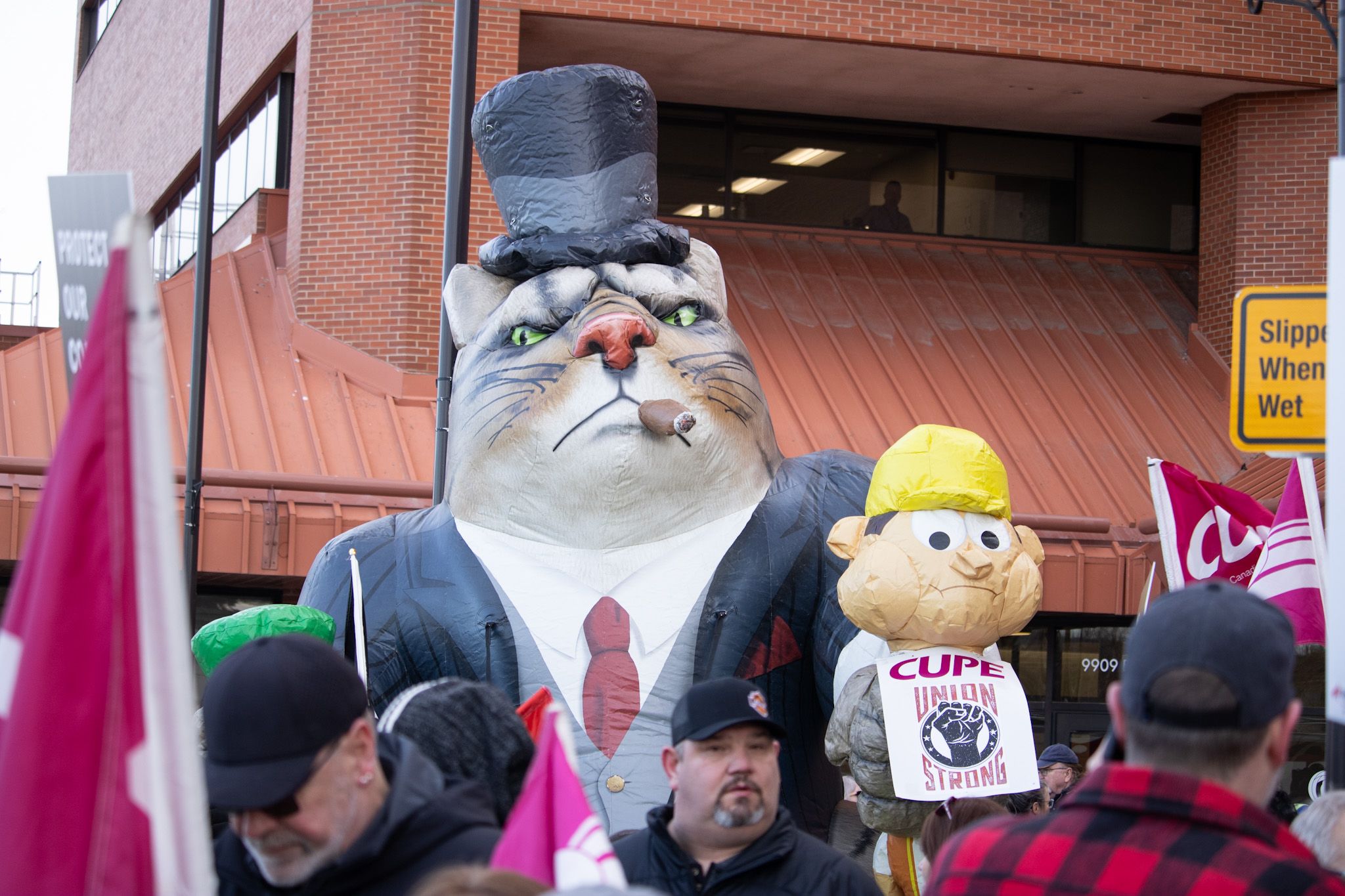 Protesters make noise against job cuts outside RMWB council meeting ...