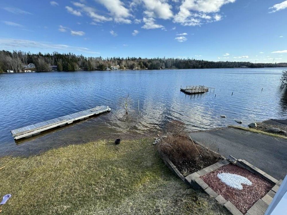 Lake Utopia residents 'on pins and needles' as water rose during rains ...