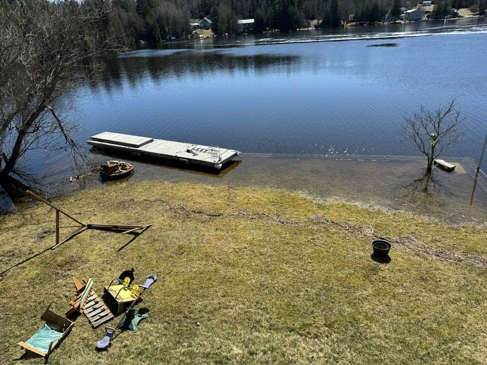 Lake Utopia residents 'on pins and needles' as water rose during rains ...