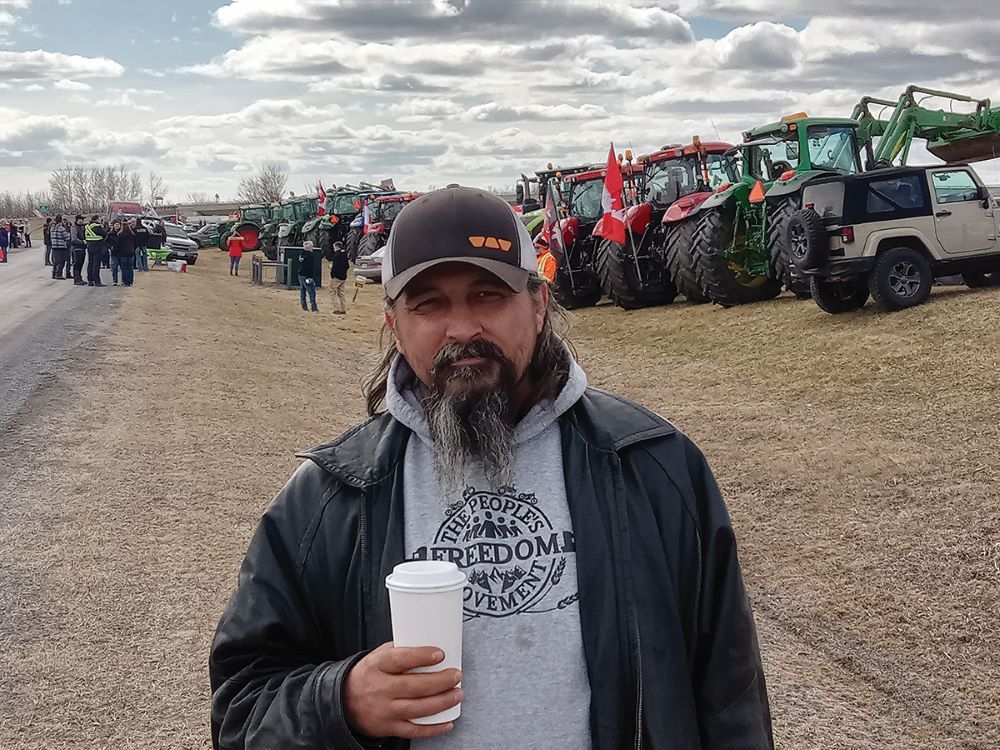 Tractors and trucks block overpass to protest carbon tax increase ...