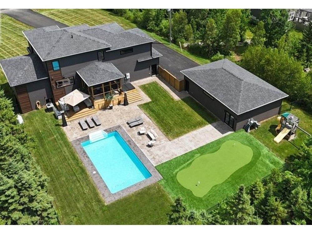 Dream Home: Custom two-storey with backyard pool, putting green ...