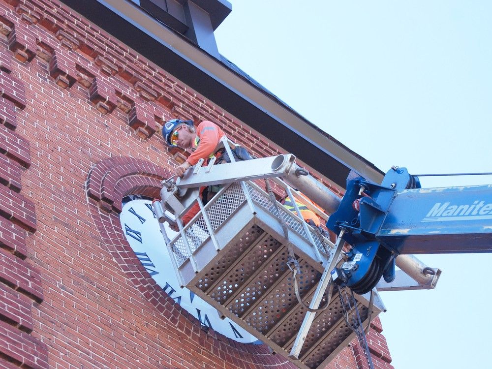 New false clock face installed in Victoria Hall’s tower, continuing ...