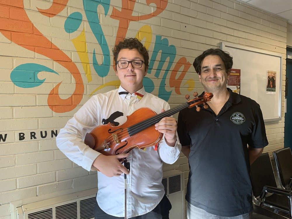 Viola player Daniel Milliea of Elsipogtog prepares for spotlight ...