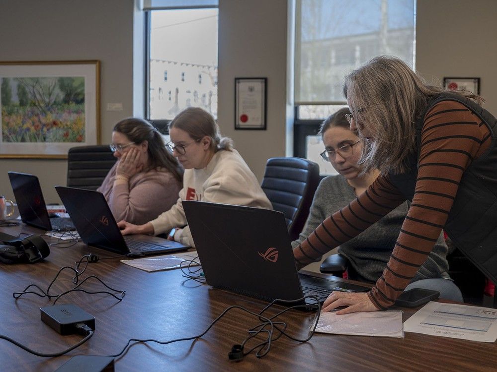 Attendees design heart-shaped jigsaw puzzles during a free workshop ...