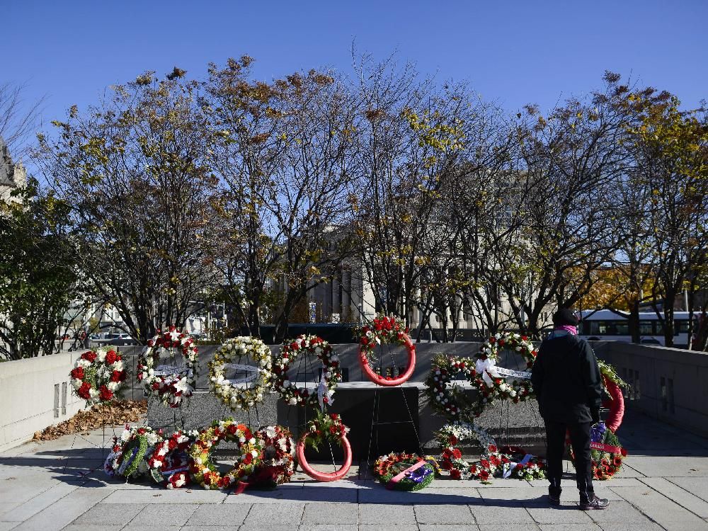 Photos: Flowers, flags, mementos removed from War Memorial | Ottawa Citizen
