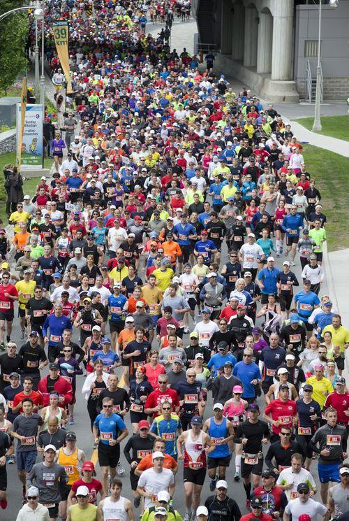 A core of vital volunteers does the heavy lifting on marathon weekend ...