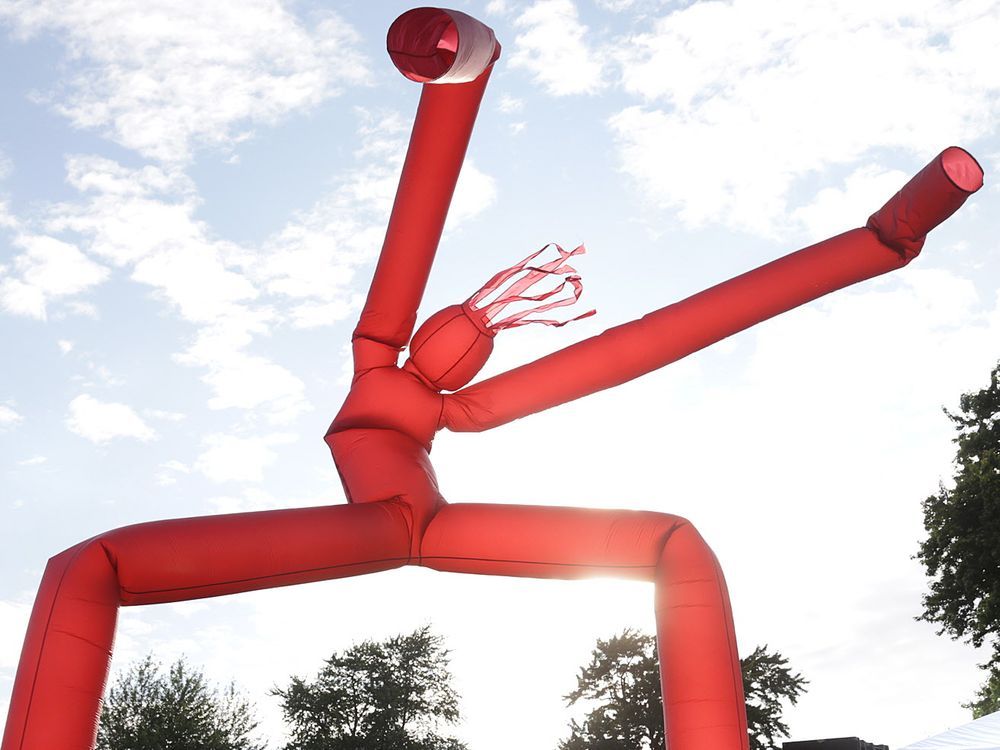 Up in arms: Thief takes inflatable waving arm man from dementia charity ...