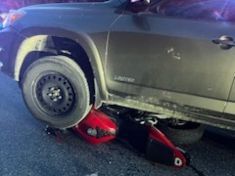 Man charged after driving SUV over motorcycle in road rage incident ...