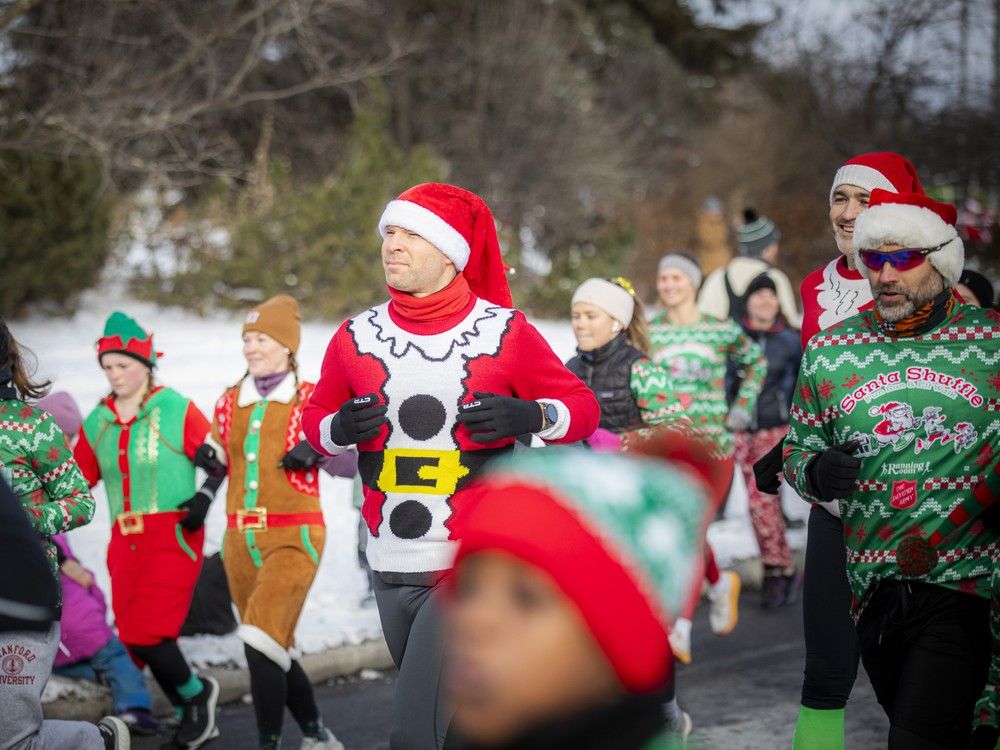 Hundreds of Santas and elves shuffle through downtown in fundraiser ...