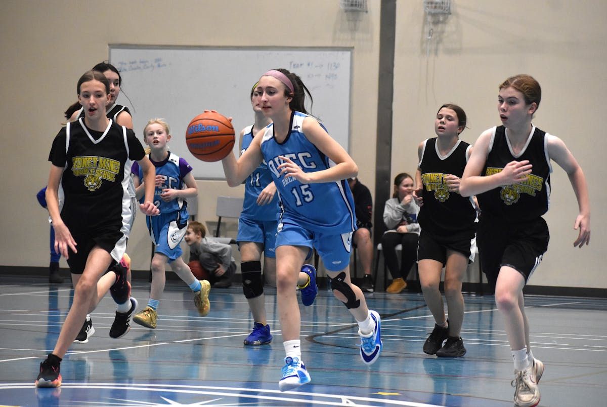 PHOTO: Breaking through the defenders on the court at the Jimmy MacNeil ...