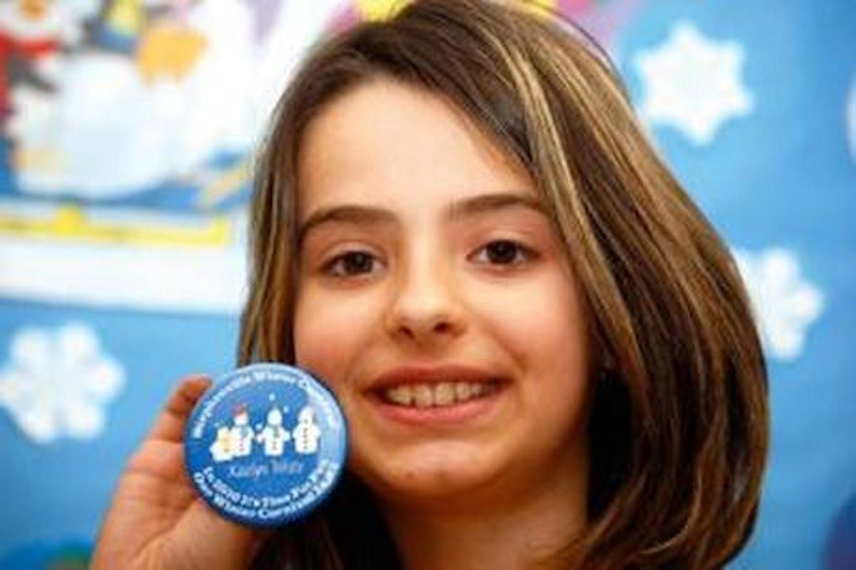 Winning slogan: Student receives first button as carnival contest ...