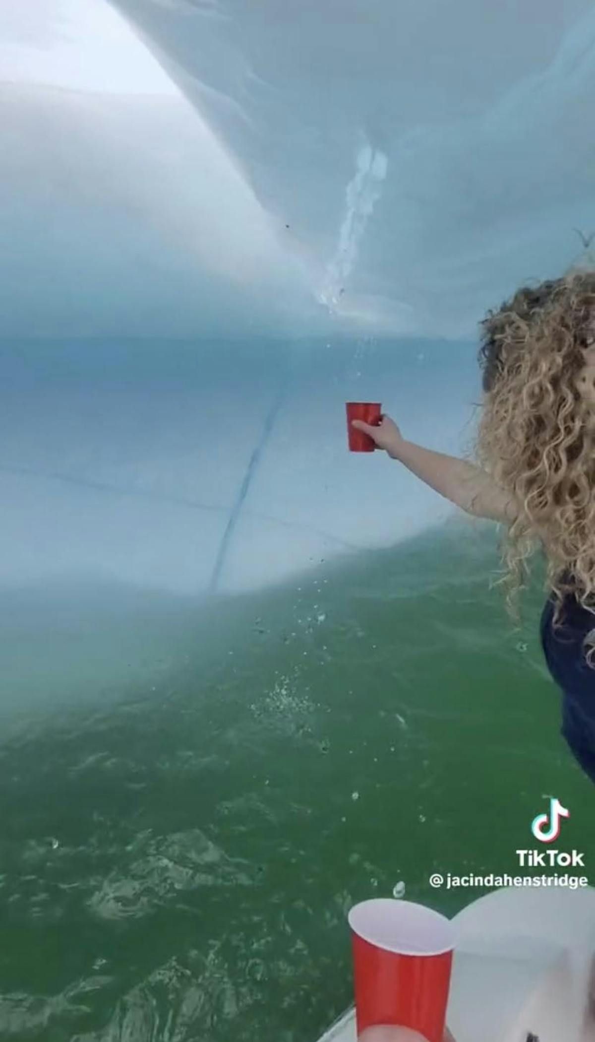 Risky business: TikTok video shows woman using disposable cup to catch ...