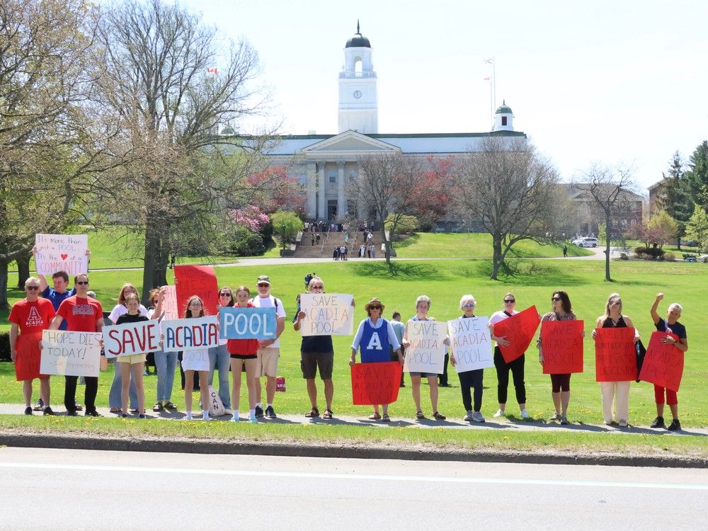 Protestors march outside Acadia University as pool closure looms | PNI ...