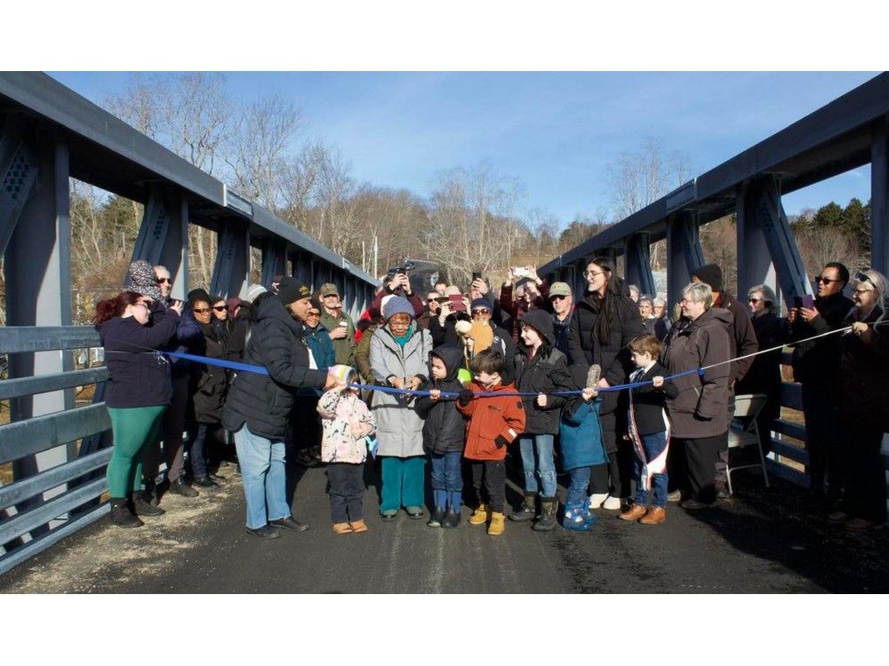 The bridge is back: Community celebrates the return of a Gates Lane ...