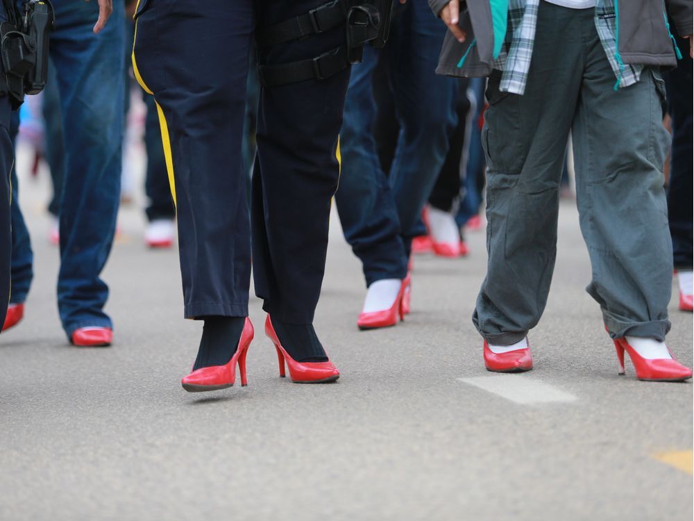 Police walk a mile in red heels for MMIW | The Star Phoenix
