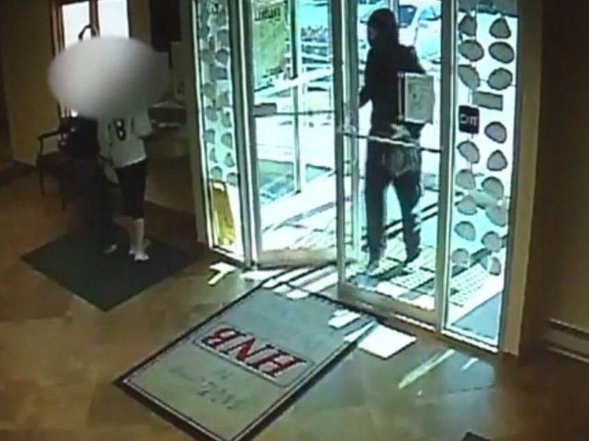 Surveillance video captures moment customer tackles bank robber ...