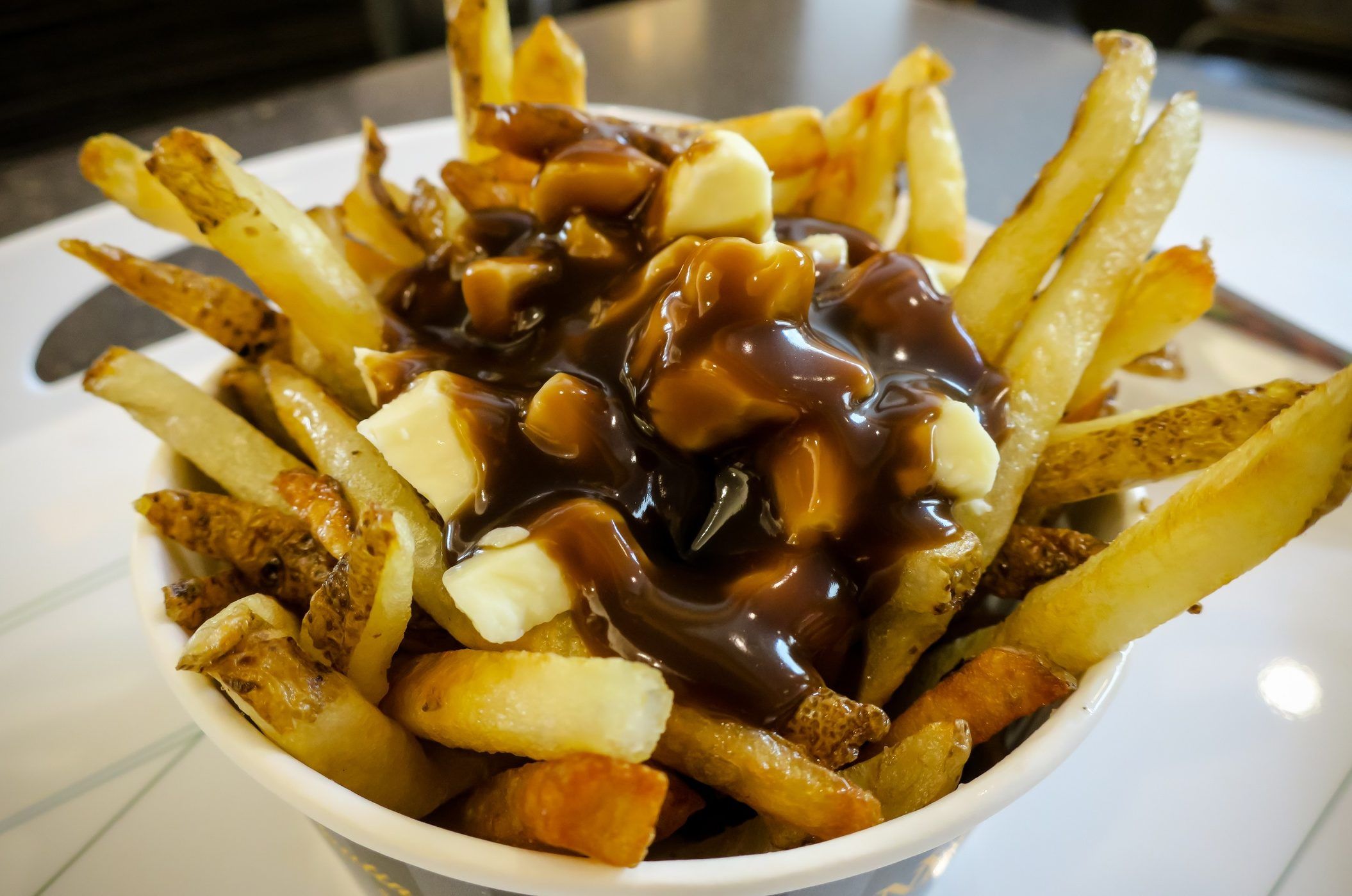 Quebec restaurant takes word 'poutine' off menu to denounce Putin ...