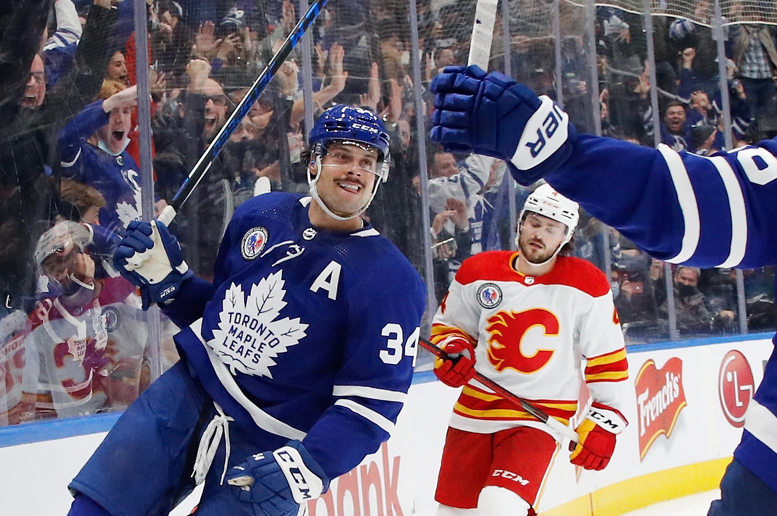 Matthews ends tight match with Flames, scoring in overtime for Maple ...