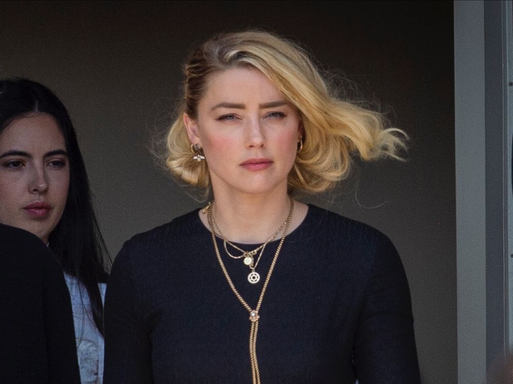 Amber Heard insists insurer must cover $8.3M she owes Johnny Depp ...