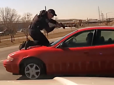 CAUGHT ON CAMERA: Cop jumps on car hood with gun doesn't go well ...