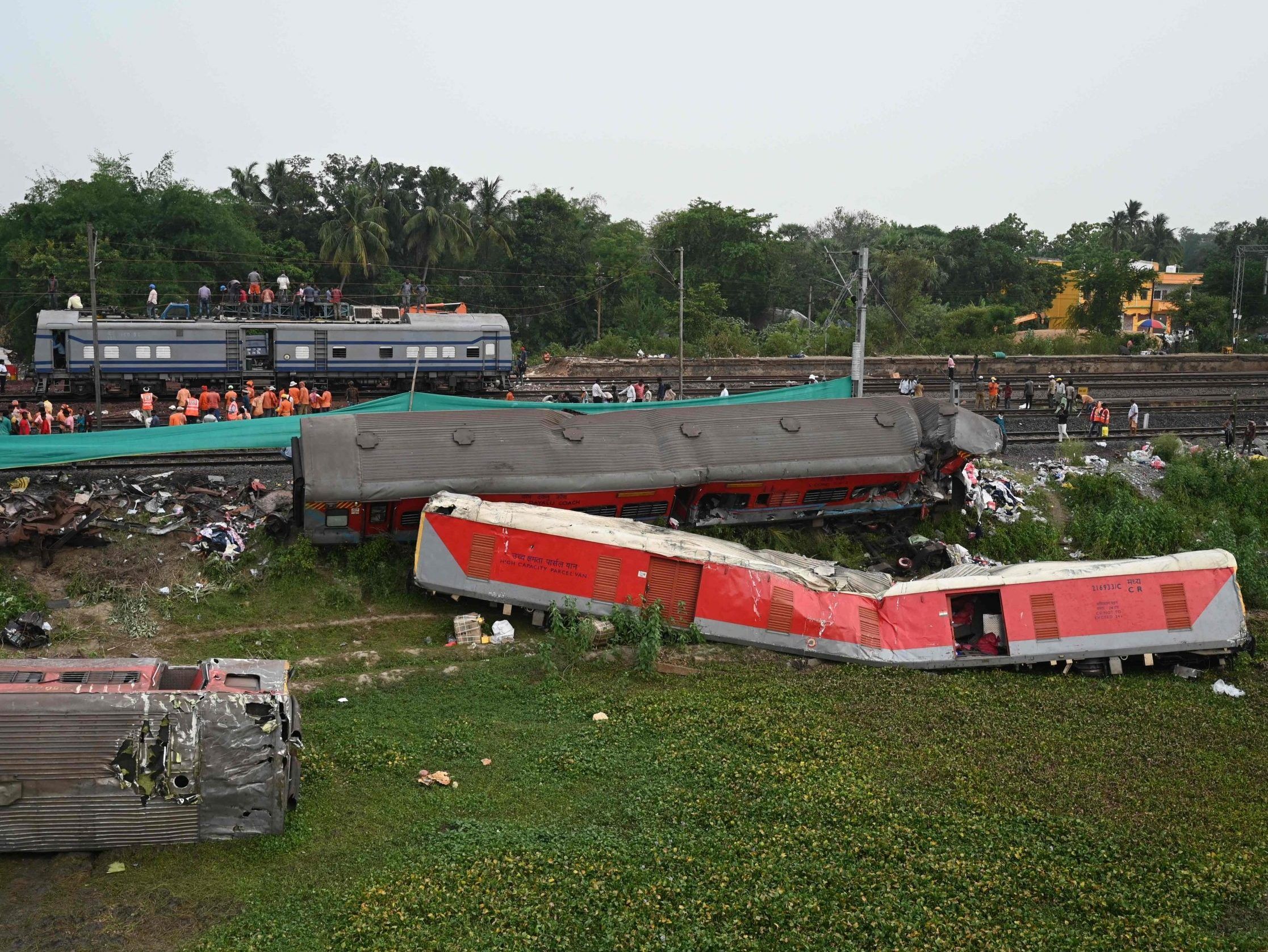 As India grieves deadly train crash, relatives try to identify bodies ...