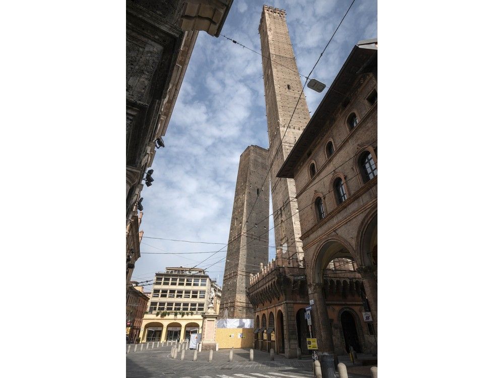 Officials secure 12th Century leaning tower to prevent collapse ...