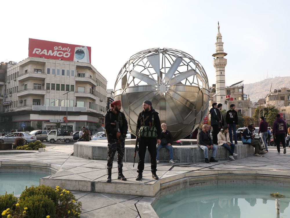 Syrian PM says government functioning, but public sector came to halt ...