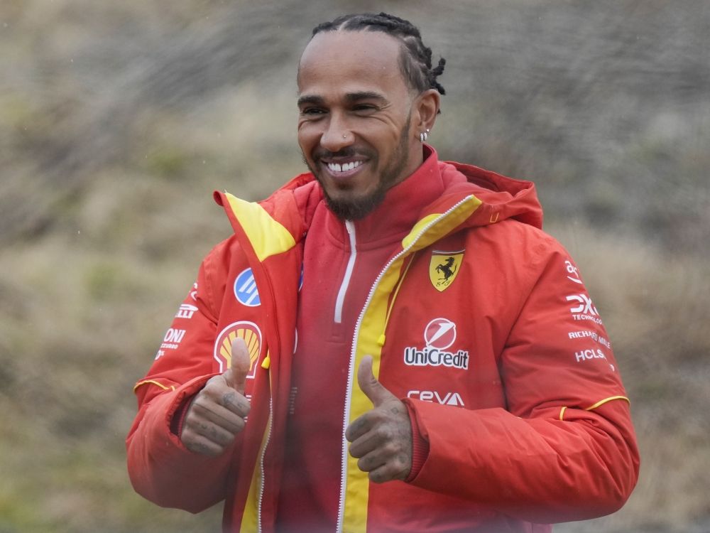 Lewis Hamilton waves to fans as he drives a Ferrari F1 car | Toronto Sun