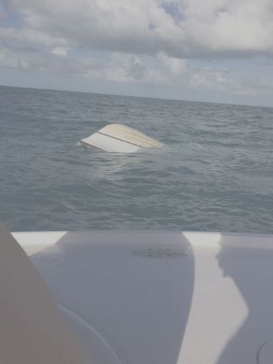 Teen boys 'lucky they had a cell signal' after boat capsizes off ...
