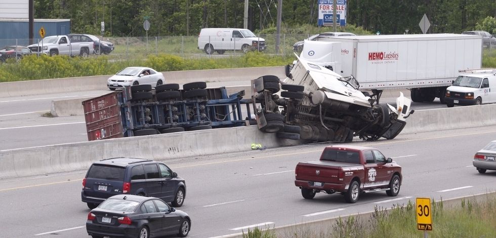 Chemical fears close QEW after truck rollover | Toronto Sun