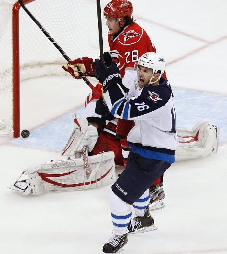 Jets beat 'Canes in OT | Winnipeg Sun