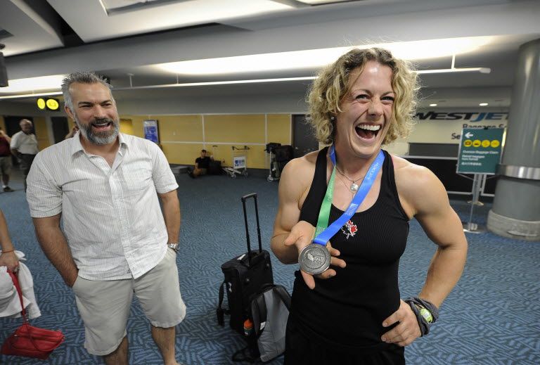 Canadian rugby star Andrea Burk receives hero's welcome at YVR ...