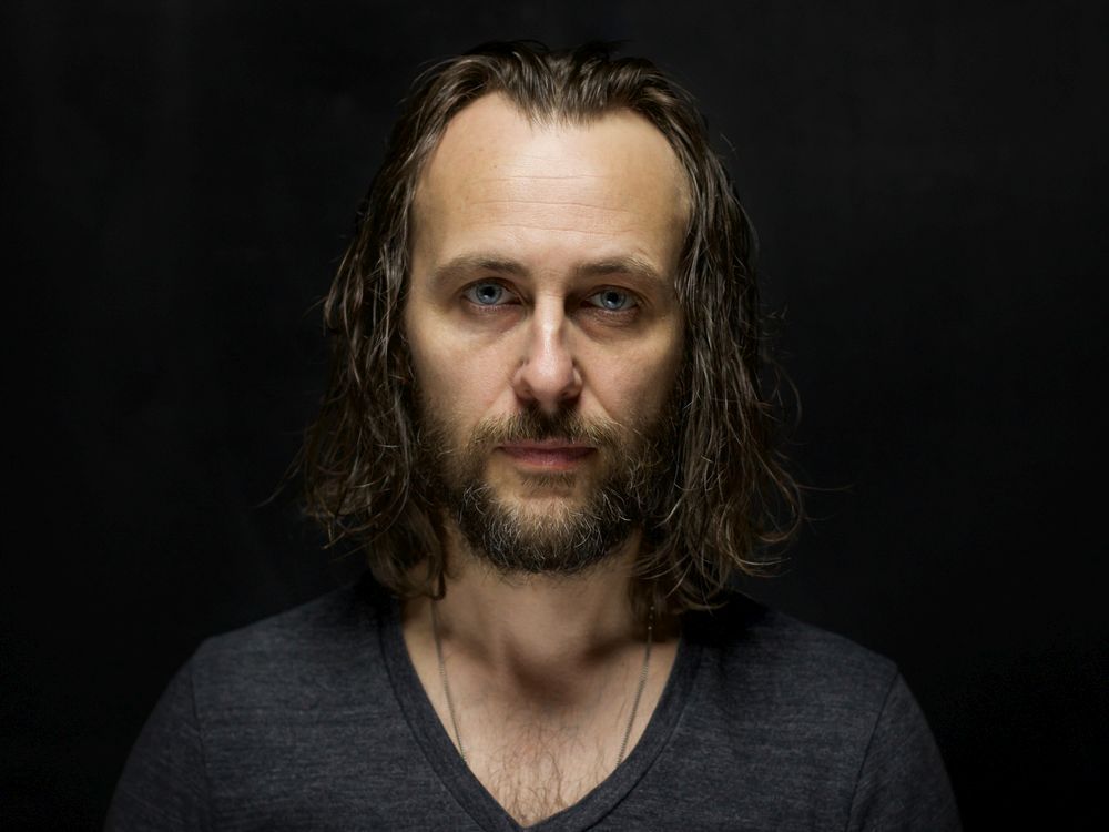 A near-dark theatre provides the setting for Adrian Glynn's acoustic ...