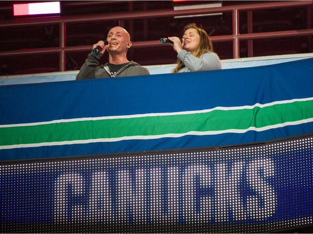 Front-line workers help Canucks face off 2021 home-opener | Vancouver Sun