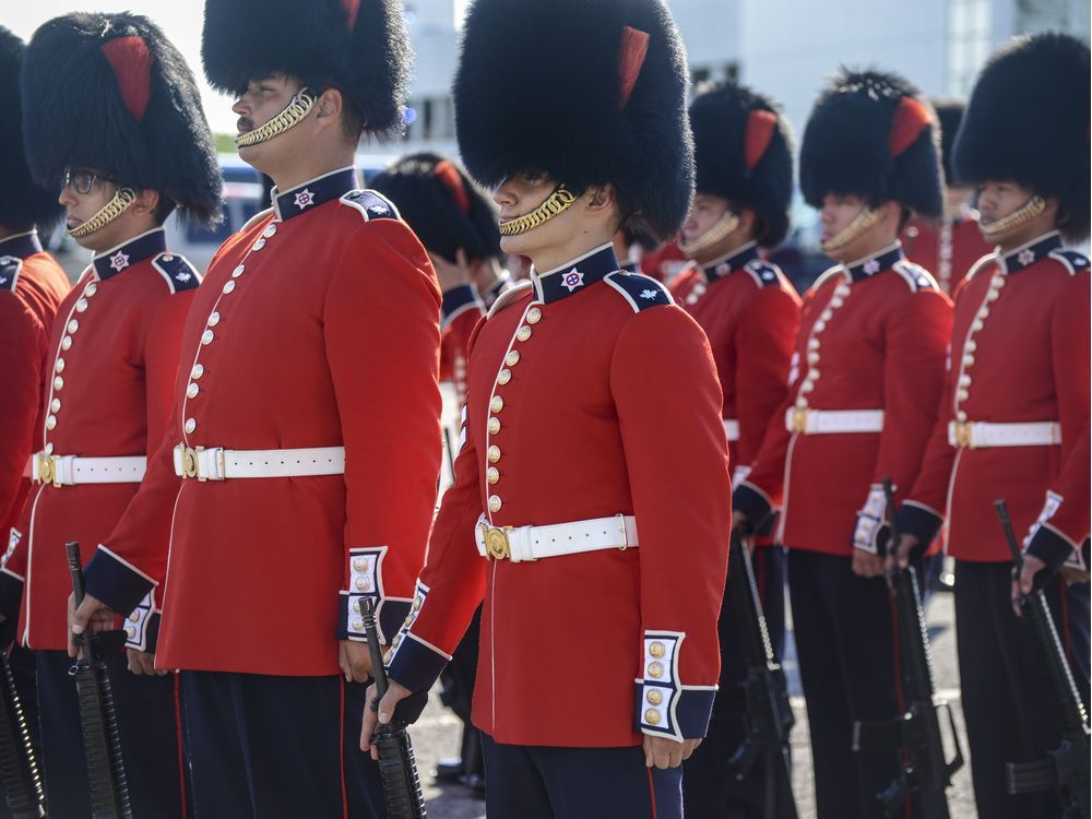 Bearskin hats and scarlet tunics; 12 from Windsor Regiment in ...