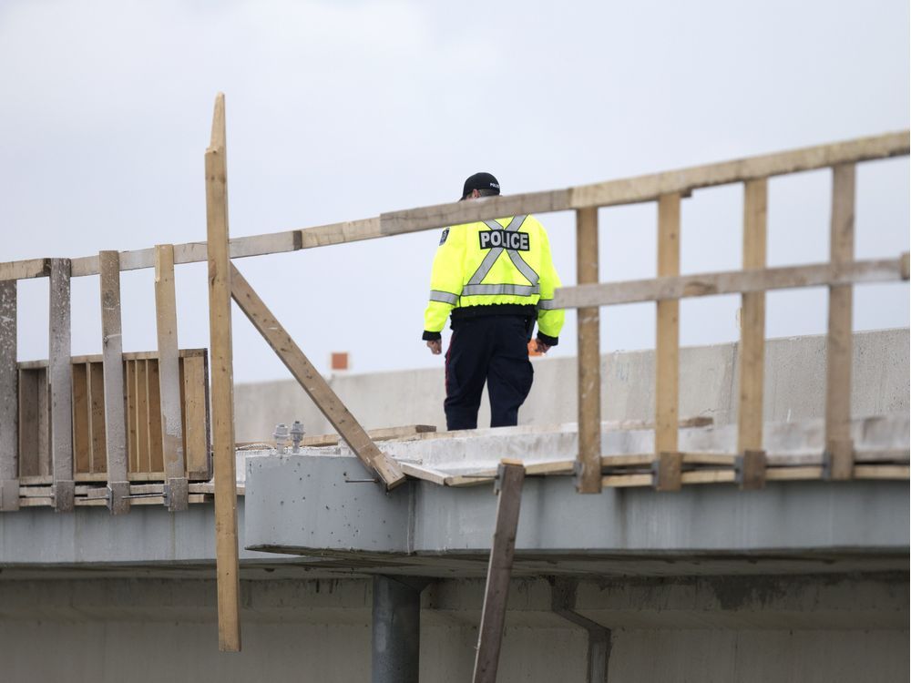Photos: Excavator falls off bridge | Windsor Star