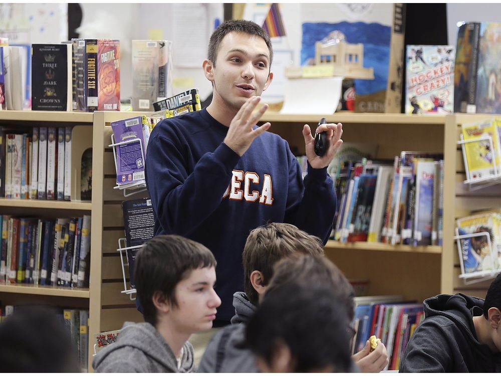 High school students teach younger peers about money management ...